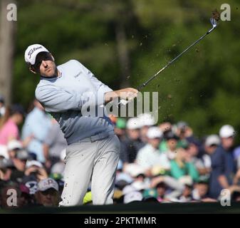 Russell Henley watches his tee shot on the 12th hole during the first ...