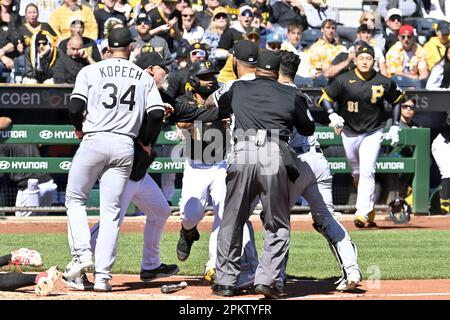 Home plate umpire Ryan Wills gives the catcher a new baseball during an ...