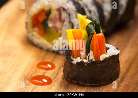 A close up of the end piece of a Korean treat called Kimbap. Food made ...