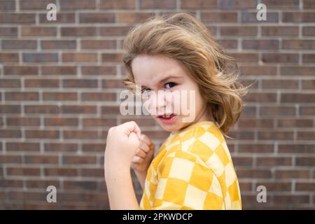 Child temper with angry expression. Angry hateful little anger boy ...
