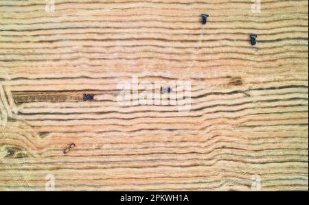 Drone aerial footage of harvesters gathering grain crops from ...