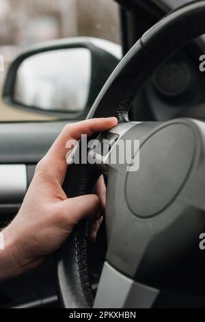 Drivers's hands on a left stearing,steering wheel of a car Stock Photo ...
