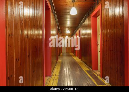 Corridor with wooden paneling inside a mountain cottage Stock Photo - Alamy