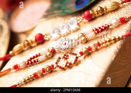 Luxury rakhi on golden background Stock Photo - Alamy
