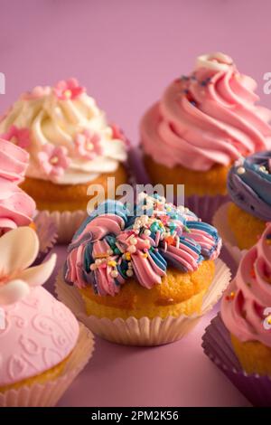 A variety of colorful cupcakes with various types of frosting Stock ...