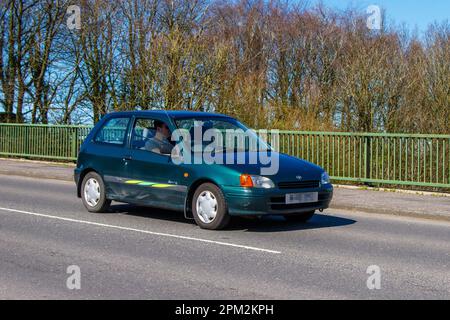 A classic Japanese car, the small Toyota Corolla XL EE90 in gray color ...