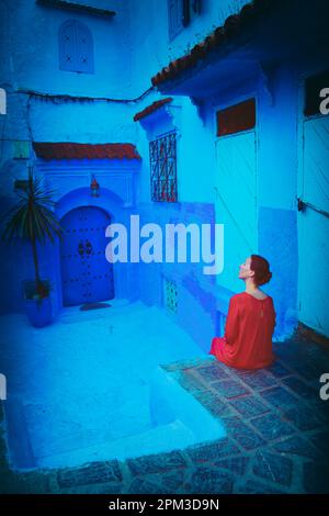 woman with orange dress in Chefchaouen V Stock Photo - Alamy