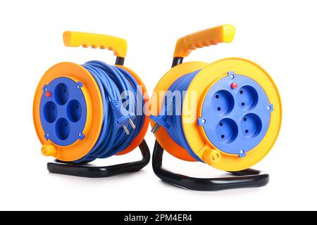 Extension electric cable reels on white background Stock Photo - Alamy
