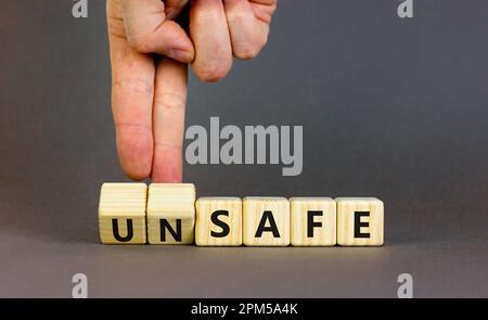 Unsafe word on grey background Stock Photo - Alamy