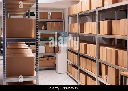 Cardboard boxes on tall shelves in warehouse Stock Photo - Alamy