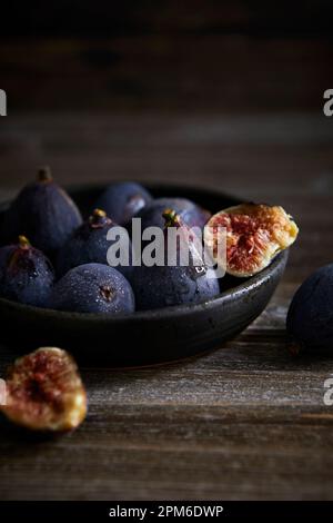 Figs on a Dark Rustic Background Stock Photo - Alamy