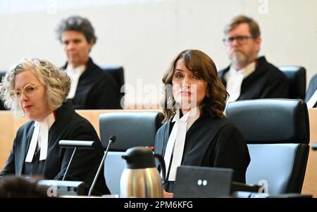 Justice David Boddice (centre) is seen being sworn in to the Court of ...