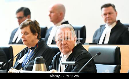 Justice David Boddice (centre) is seen being sworn in to the Court of ...