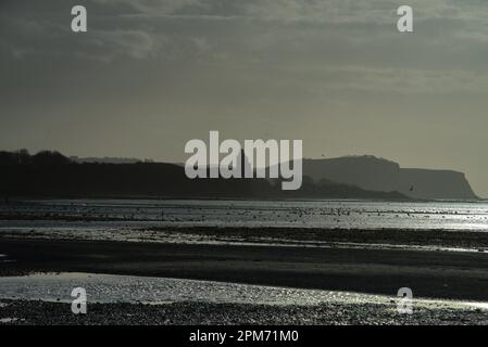 Ayr beach at sunset, looking over towards Greenan castle Stock Photo ...