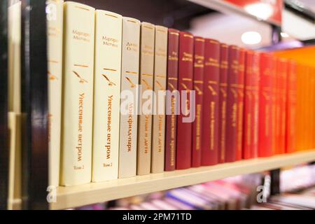 Different editions of books are on the shelf and ready for sale Stock ...