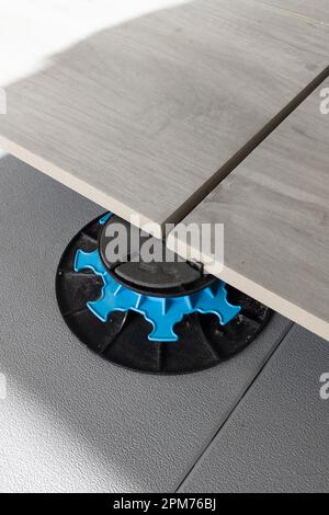 plots pavement grey tiles installation on house terrace with adjustable ...