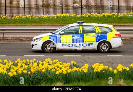 A Police Scotland police car travelling along the Kingsway West Dual ...