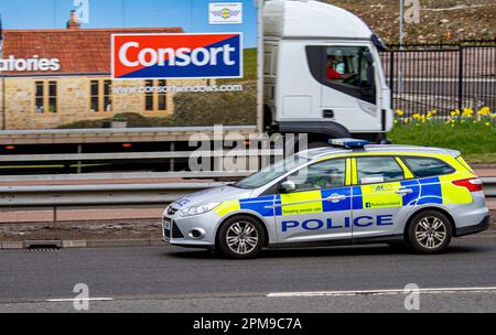 A Police Scotland police car travelling along the Kingsway West Dual ...