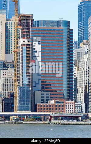 The red-and-blue glass AIG Building, 175 Water Street, towers over New ...