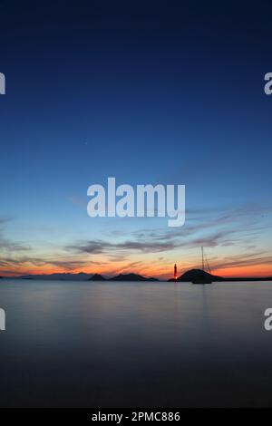 Seascape at sunshine. Lighthouse and sailings on the coast. Seaside ...