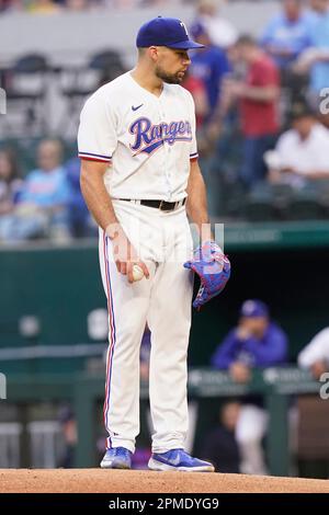 Texas Rangers starting pitcher Nathan Eovaldi (17) walks back to the ...