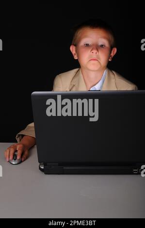 A Young boy businessman hard at work Stock Photo - Alamy