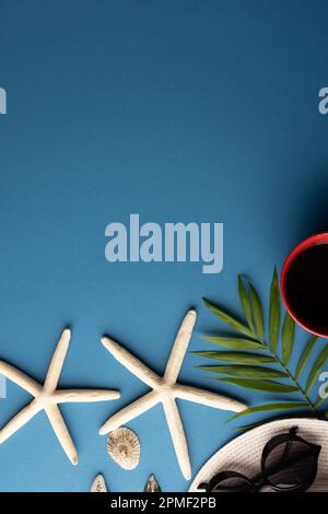 Straw hat with seashells on blue wooden boards, accessories for ...