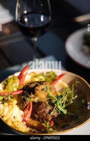 Roasted Pork Knuckle with succulent sauce, kaymak and vegetables Stock ...