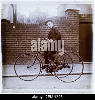 Young lad on an early tricycle - 1890 Stock Photo - Alamy
