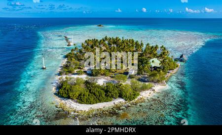 Aerial of the little island at the Avatoru Pass, Rangiroa atoll ...