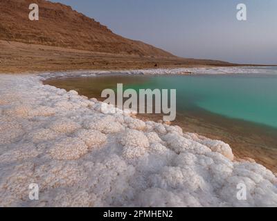Shore with salt crystalized formation and turquoise water, The Dead Sea ...