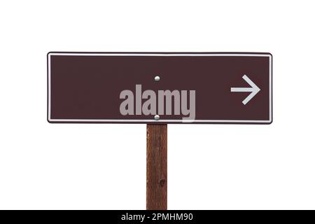 Arrow sign cut out of brown paper on piece of wood Stock Photo - Alamy