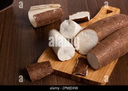 Fresh Organic Cassava Root, Manioc Esculenta, yuca On purple Background ...