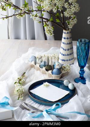 Stylish table setting for Easter celebration on light background Stock ...