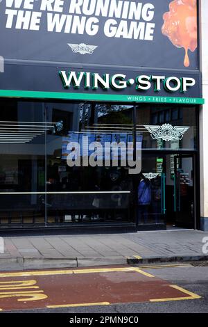 Wing Stop chicken restaurant logo Stock Photo - Alamy