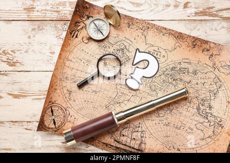 World map with question mark, spyglass, compass and magnifier on white ...