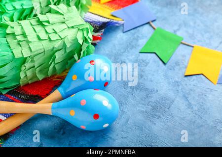 Mexican maracas with pinata, serape and flags on grunge background ...