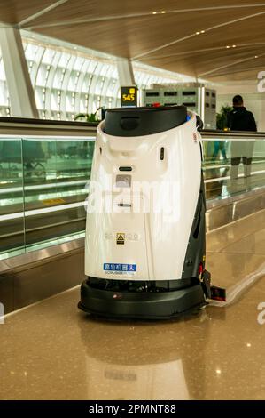 A Gaussian Robotics Scrubber 50 autonomous robot cleaner and a real ...
