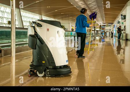 A Gaussian Robotics Scrubber 50 autonomous robot cleaner and a real ...