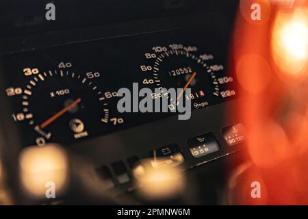 Milan, Italy 11 april 2023: Close-up of odometer and dashboard gauges ...