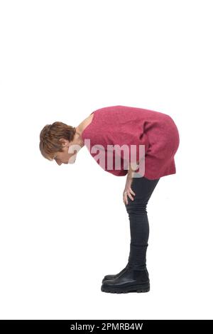 crouched woman looking at the ground to the side looking for something ...