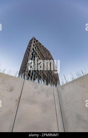 Art installation made of concrete and glass standing in front of the ...