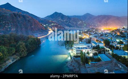 A long shutter photo of Kokcha river in a sunset with blue sky ...