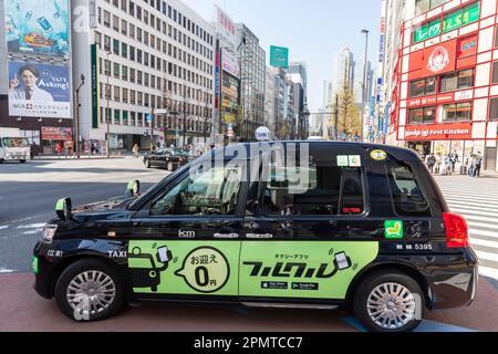 Shinjuku Tokyo April 2023, Toyota JPN black hybrid electric taxi cab ...