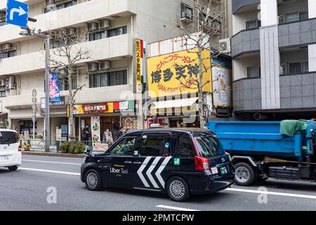 Shinjuku Tokyo April 2023, Toyota JPN black hybrid electric taxi cab ...