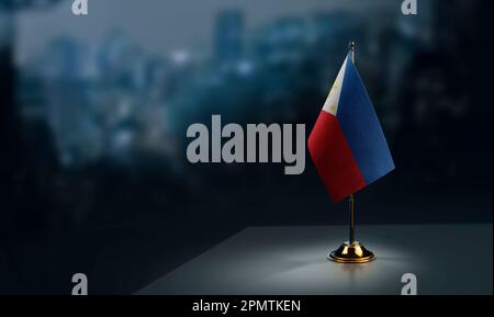 Small flags of the Philippines on an abstract blurry background Stock ...