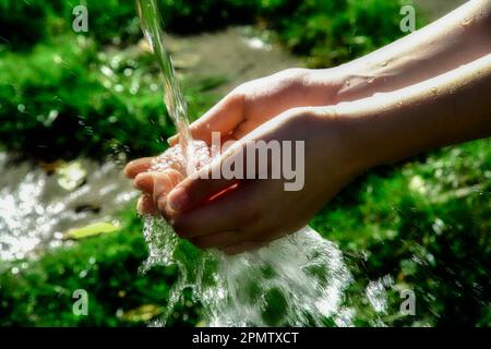 let water run into your hands Stock Photo - Alamy