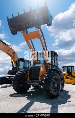 Fleet of yellow construction machines. High quality photo Stock Photo ...