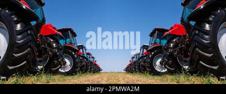 Agricultural tractors on a field. High quality photo Stock Photo - Alamy