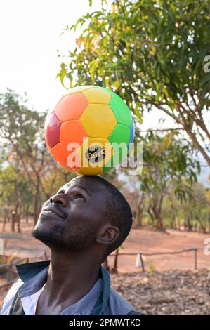 MALAWI, Livingstonia, soccer player with fair trade football / Spieler ...
